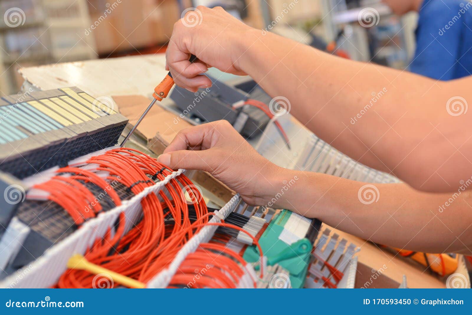 The Electrician is Connecting the Electric Cable Wire. Stock Photo ...