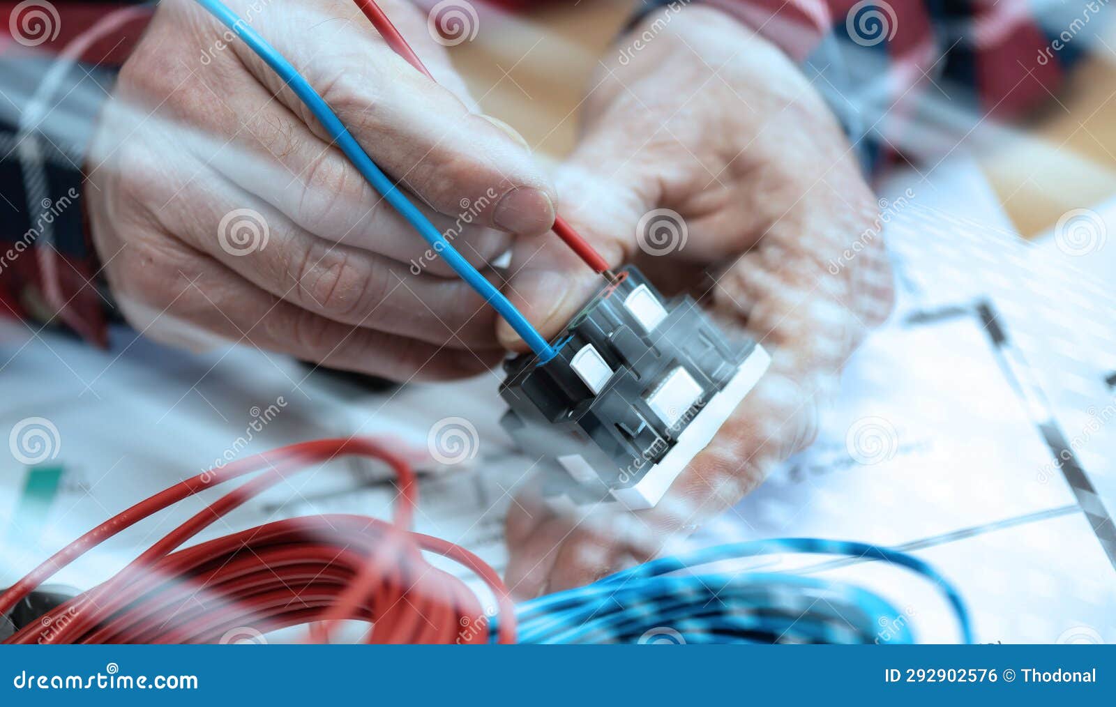 Electrician Connecting a Wire into a Power Socket Light Effect Stock ...