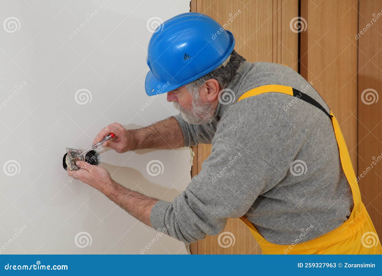 Electrician at Construction Site Install Electrical Plug Stock Image ...