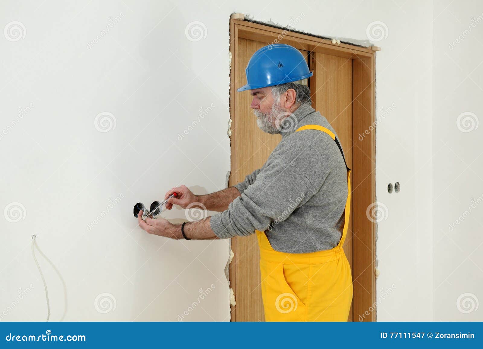Electrician at Construction Site Install Electrical Plug Stock Image ...