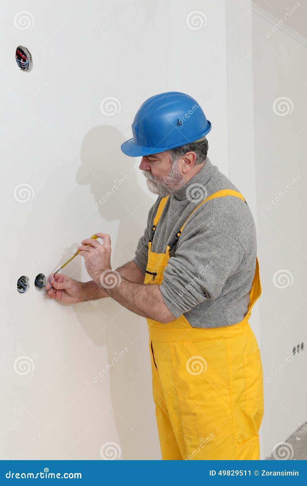 Electrician at Construction Site Testing Installation Stock Image ...