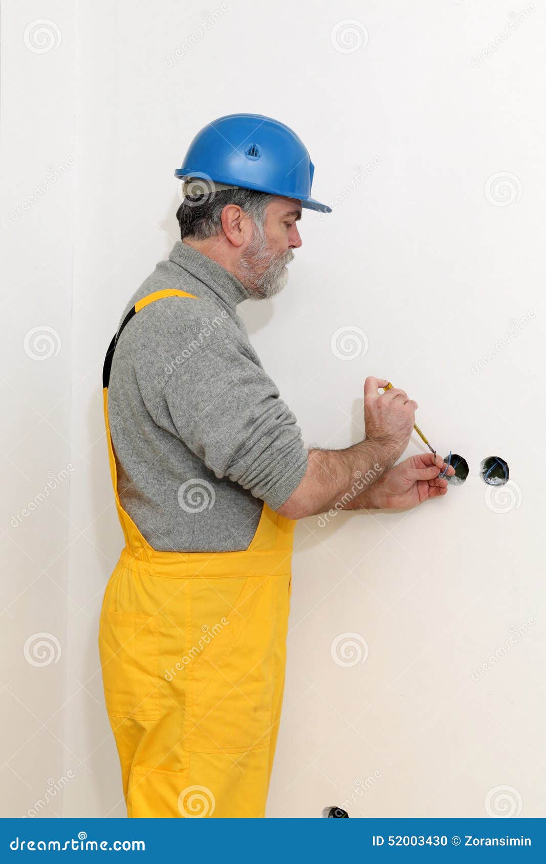 Electrician at Construction Site Testing Installation Stock Photo ...