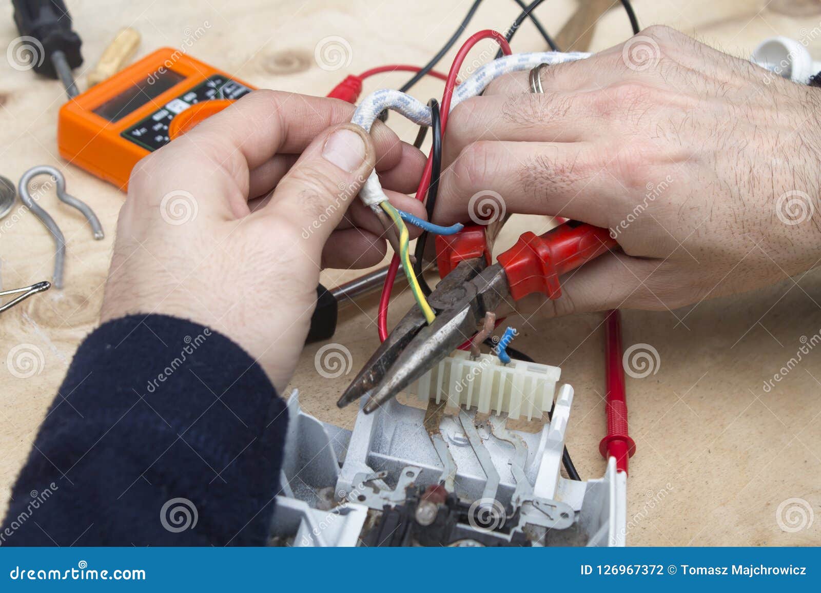 Electrician Crosses the Power Supply with the Tool. Stock Photo - Image ...