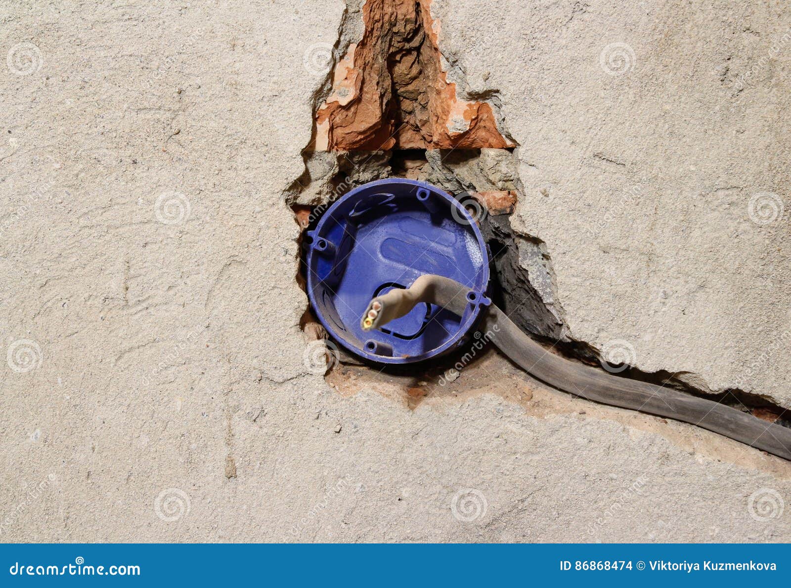 Electrician Dismantling Broken Wall Electric Socket. on Grey Con Stock ...