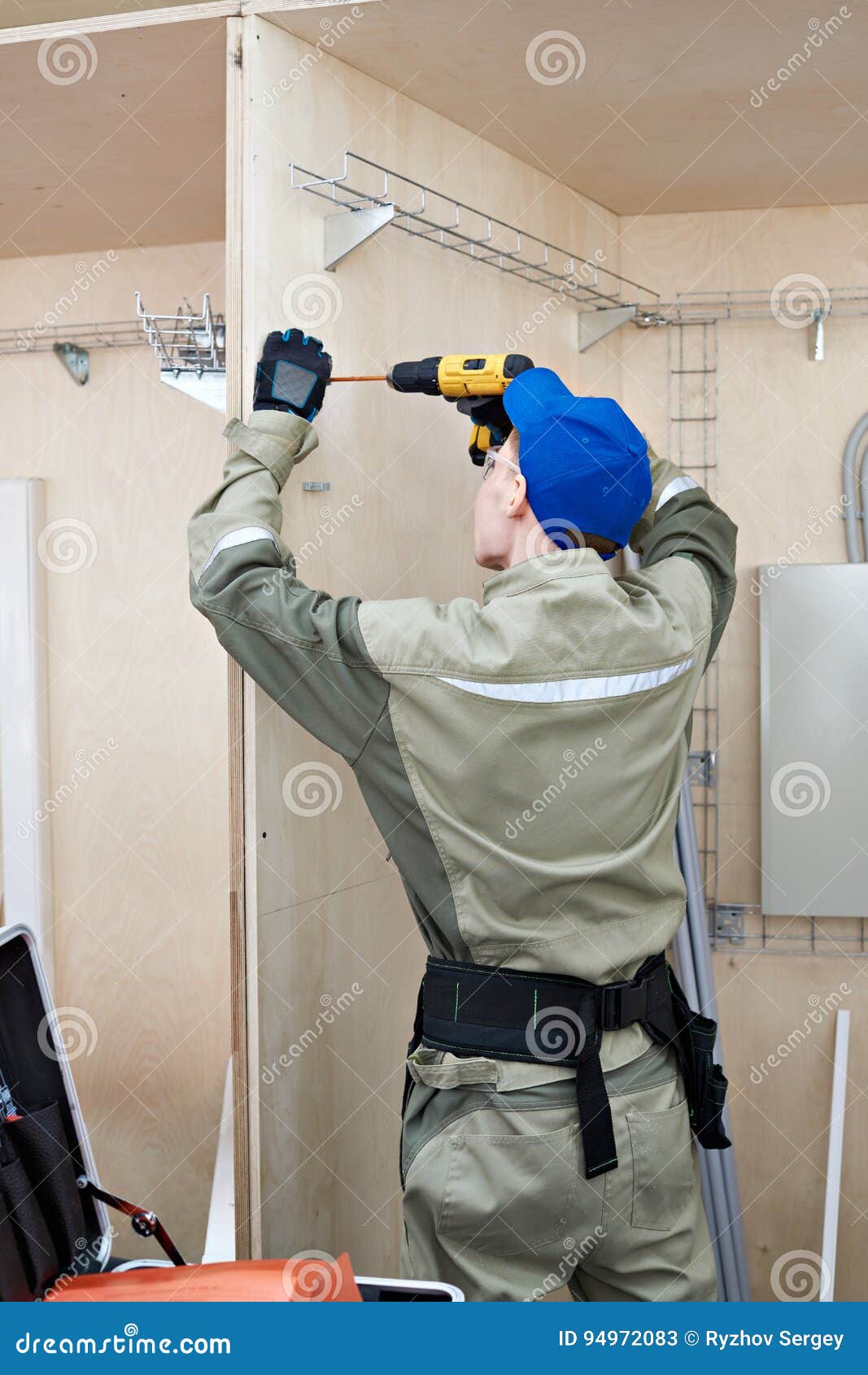 Electrician Drills Holes for Cable Routing Stock Image - Image of ...