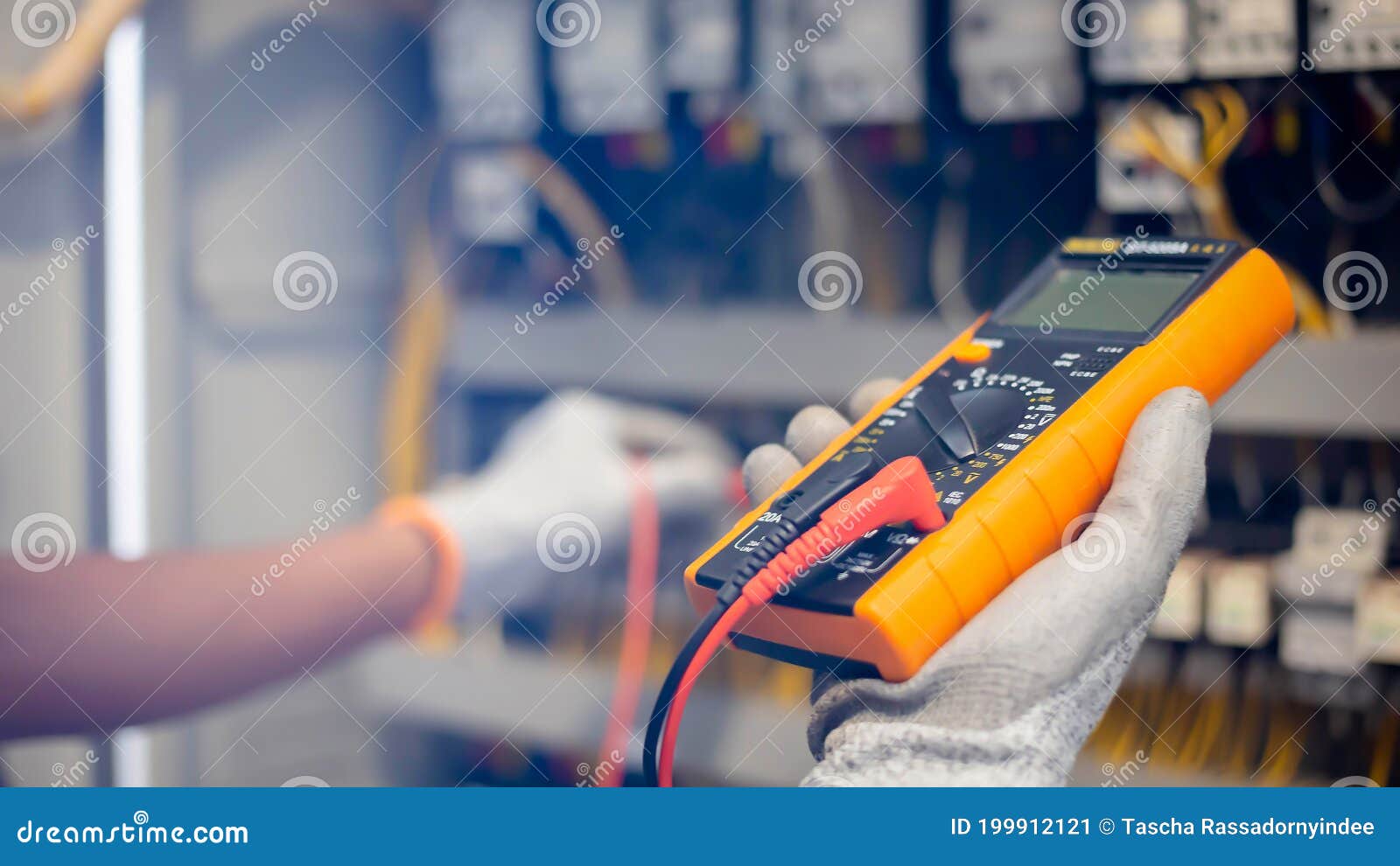 Electrician Engineer Uses a Multimeter To Test the Electrical ...