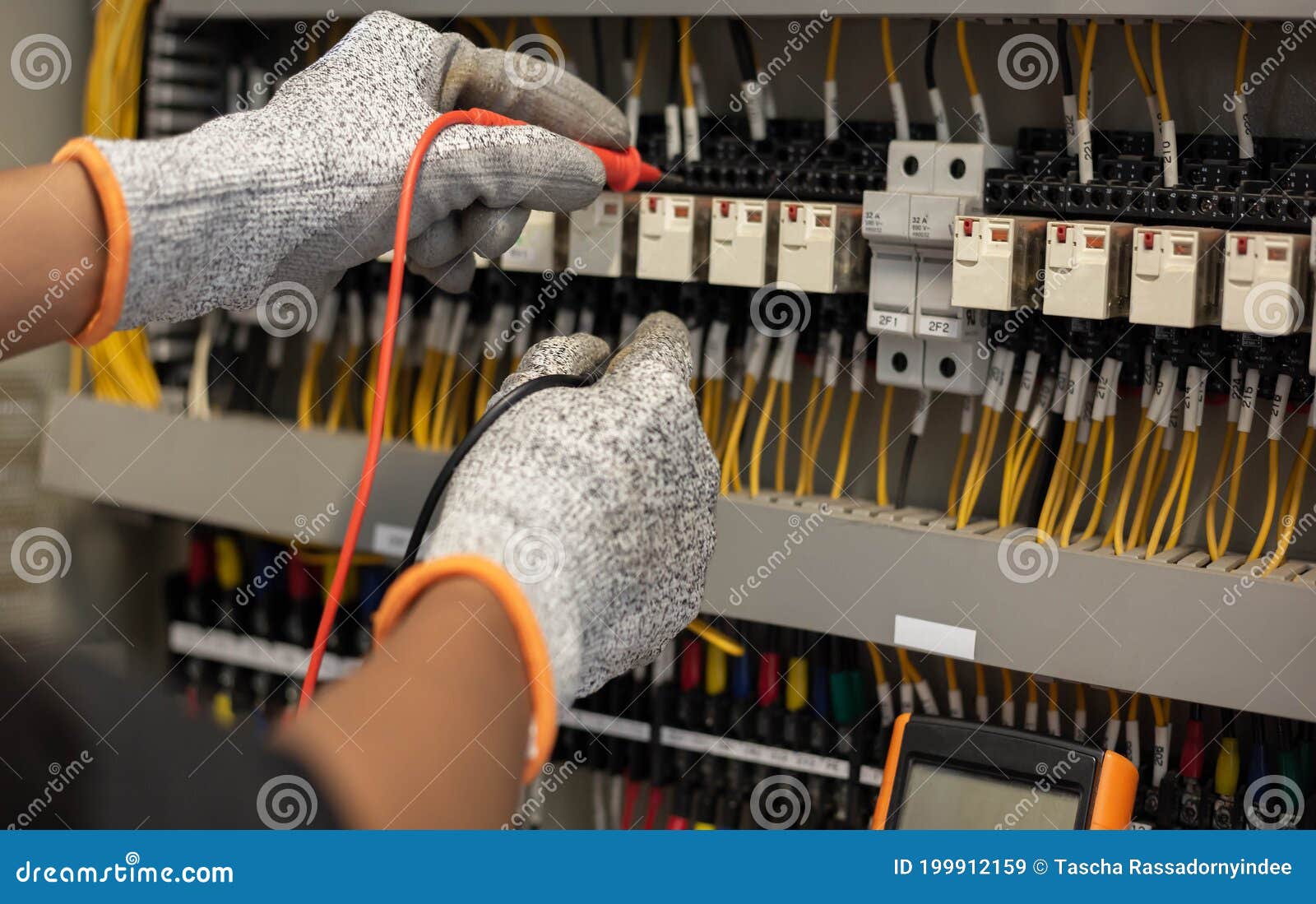 Electrician Engineer Uses a Multimeter To Test the Electrical ...