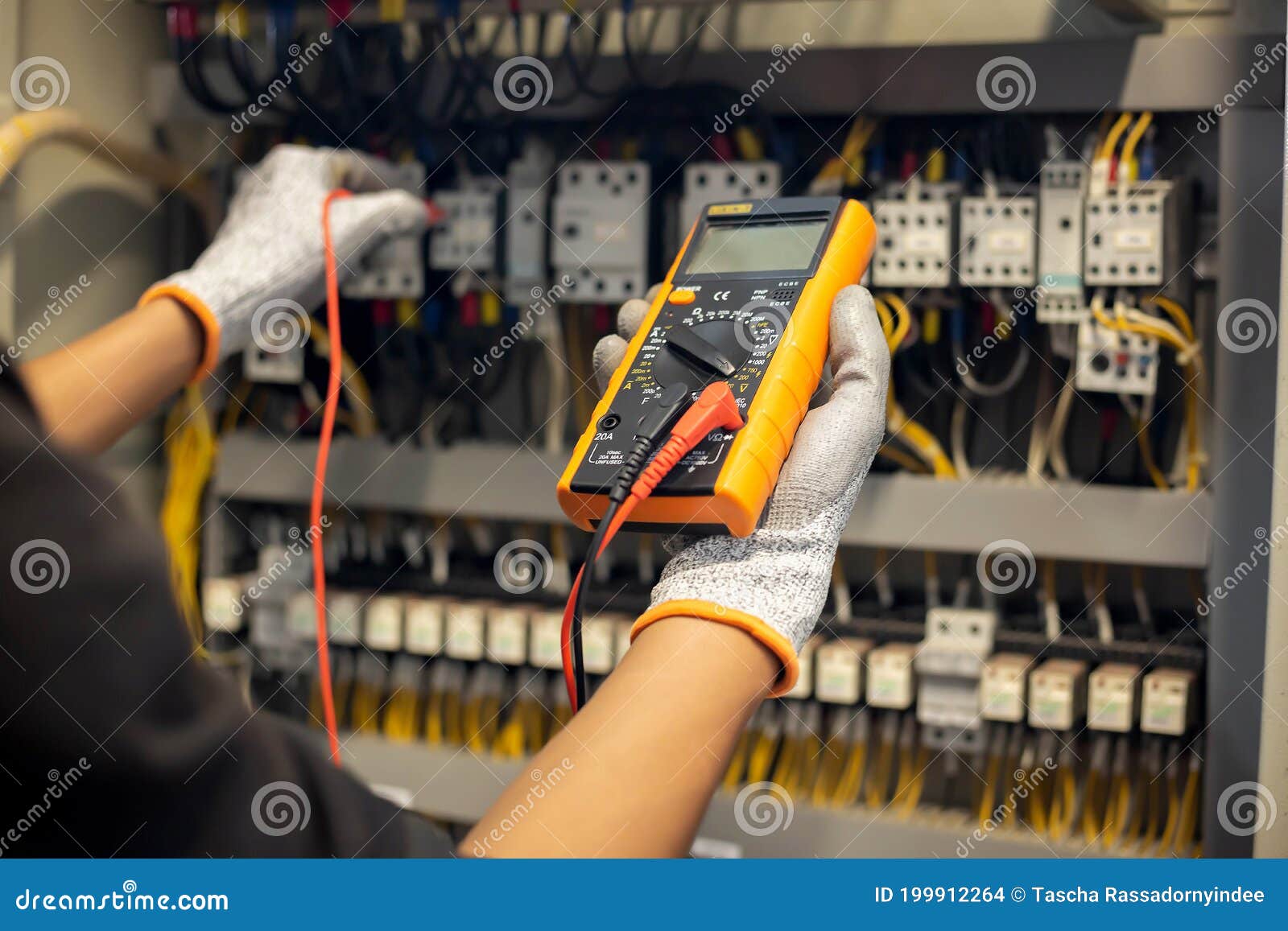 Electrician Engineer Uses a Multimeter To Test the Electrical ...