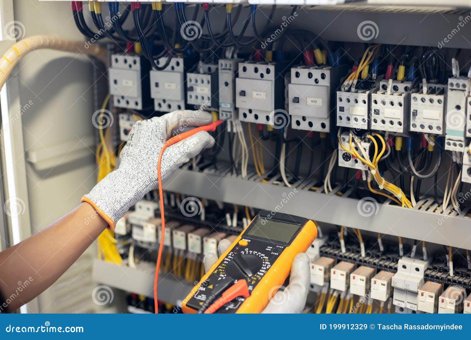 Electrician Engineer Uses a Multimeter To Test the Electrical ...