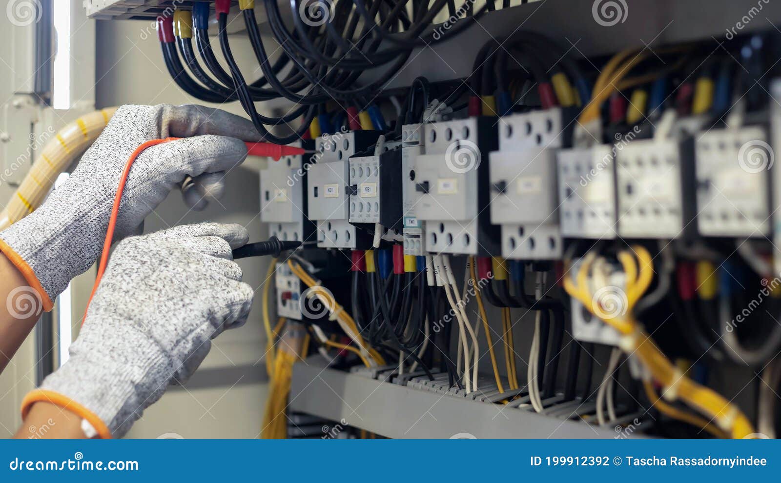 Electrician Engineer Uses a Multimeter To Test the Electrical ...