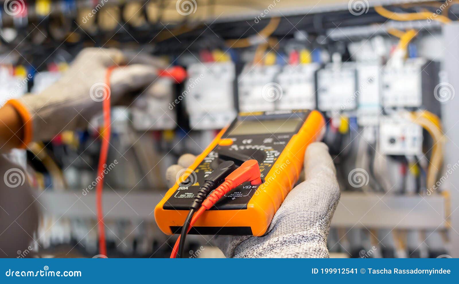 Electrician Engineer Uses a Multimeter To Test the Electrical ...