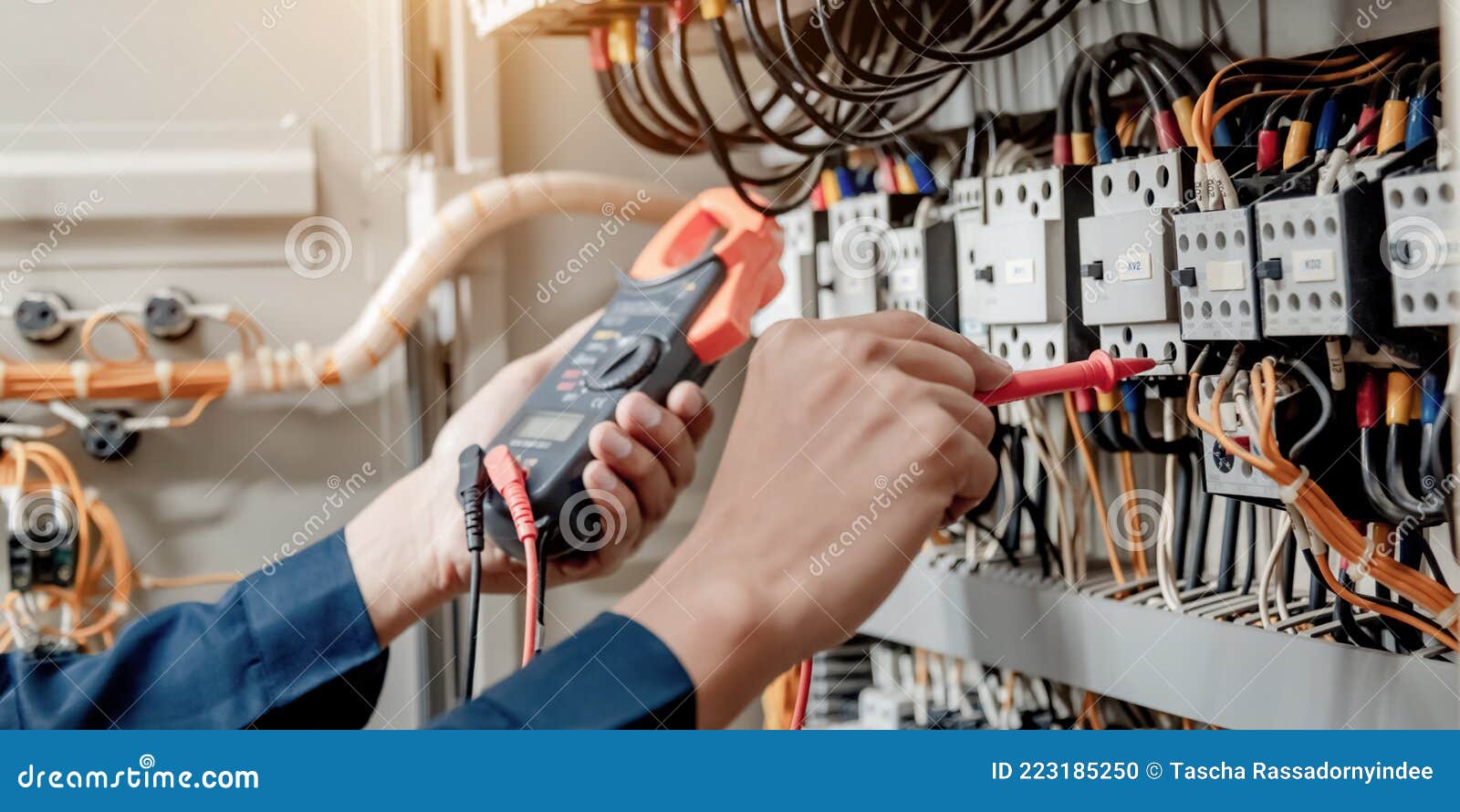 Electrician Engineer Uses a Multimeter To Test the Electrical ...