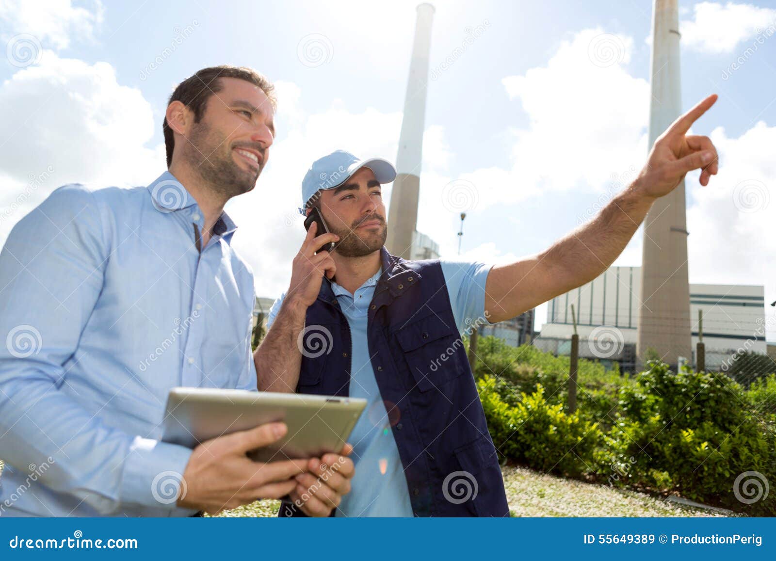Electrician and Engineer Working Together at the Electric Station Stock ...