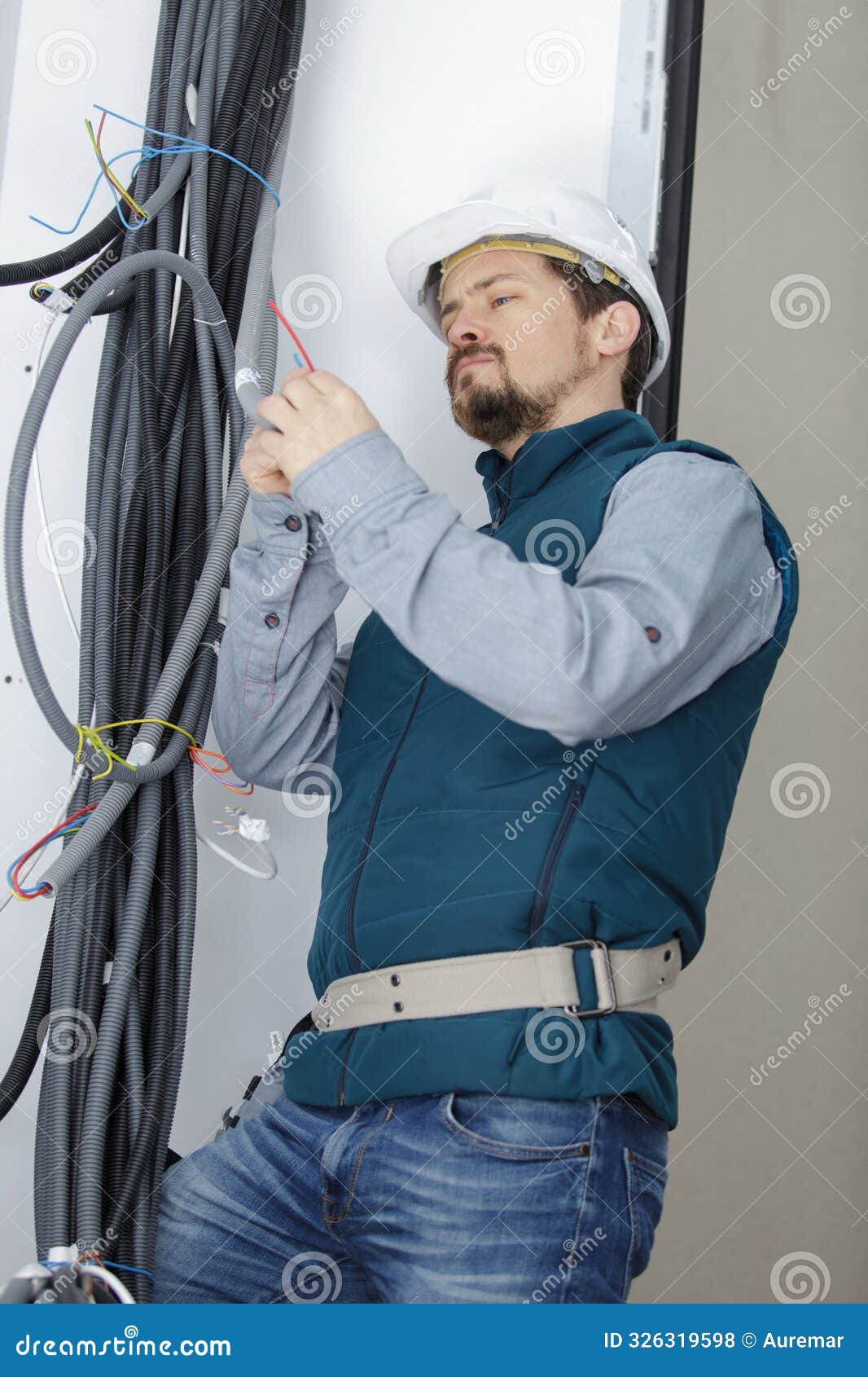 Electrician Engineer Works with Electric Cable on Fuse Switch Box Stock ...