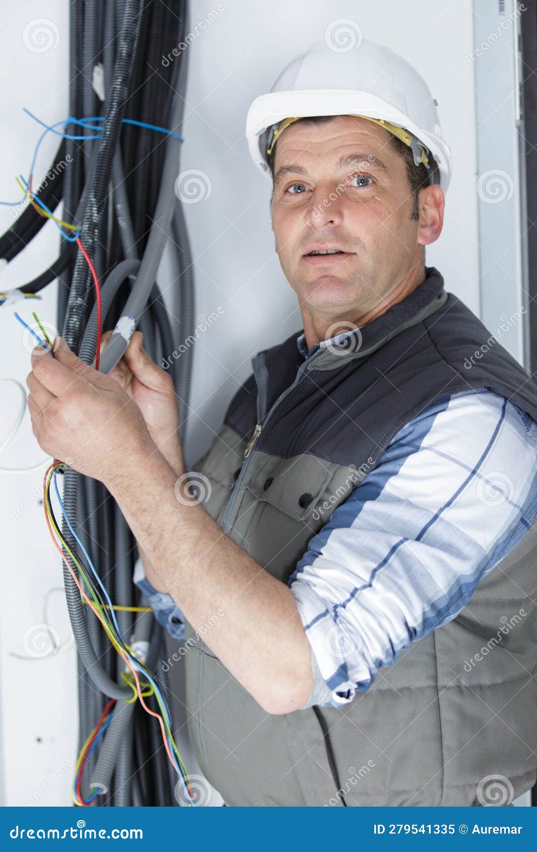 Electrician Fitting Wiring on Construction Site Stock Image - Image of ...