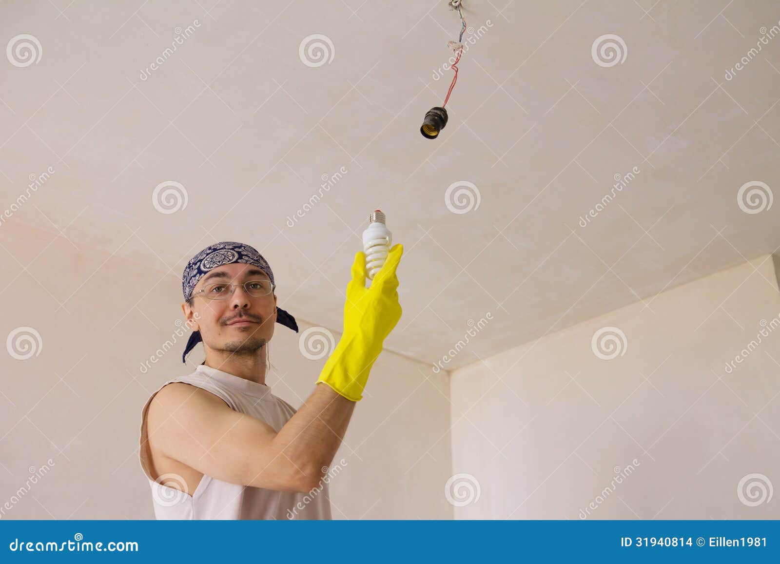 Electrician Fixing Ceiling Light Stock Photo - Image of hand ...