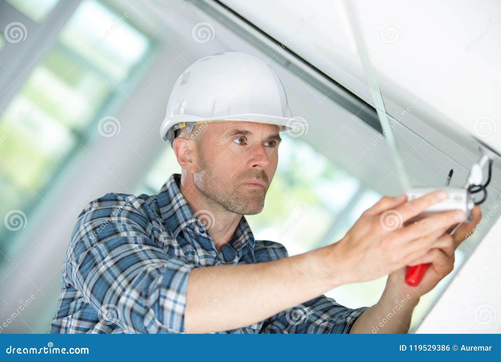 Electrician Fixing Light on Ceiling Stock Photo - Image of craftsman ...