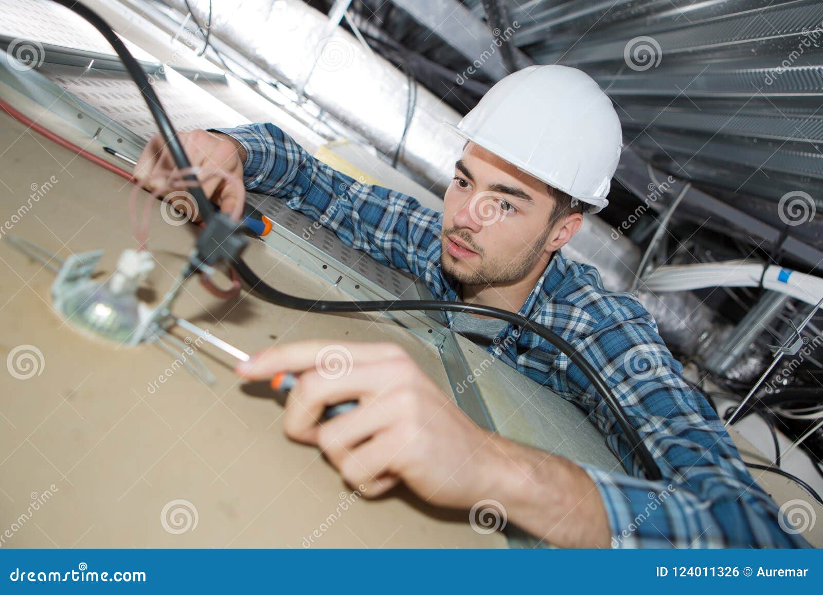 An Electrician Fixing Wires Stock Photo - Image of cables, ethnicity ...