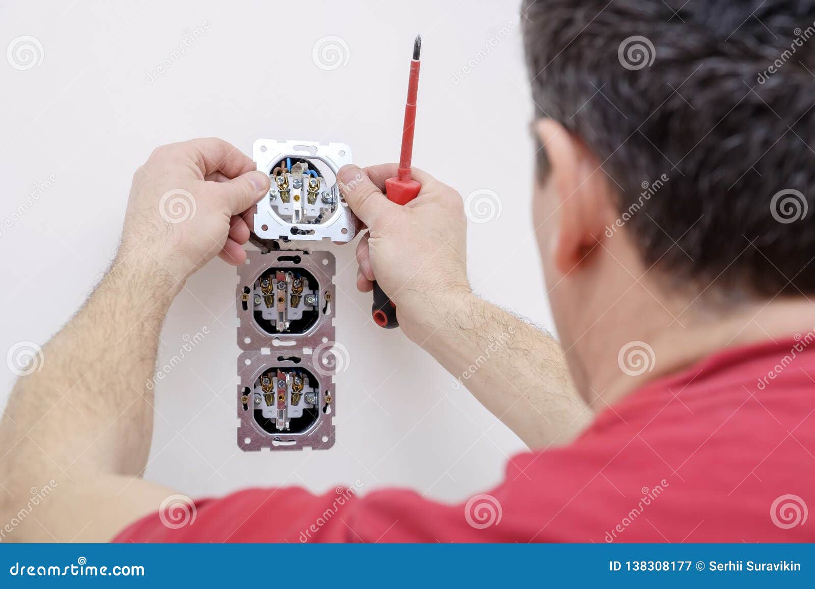 Electrician Hand Holds Socket in Process Installation Using Screwdriver ...