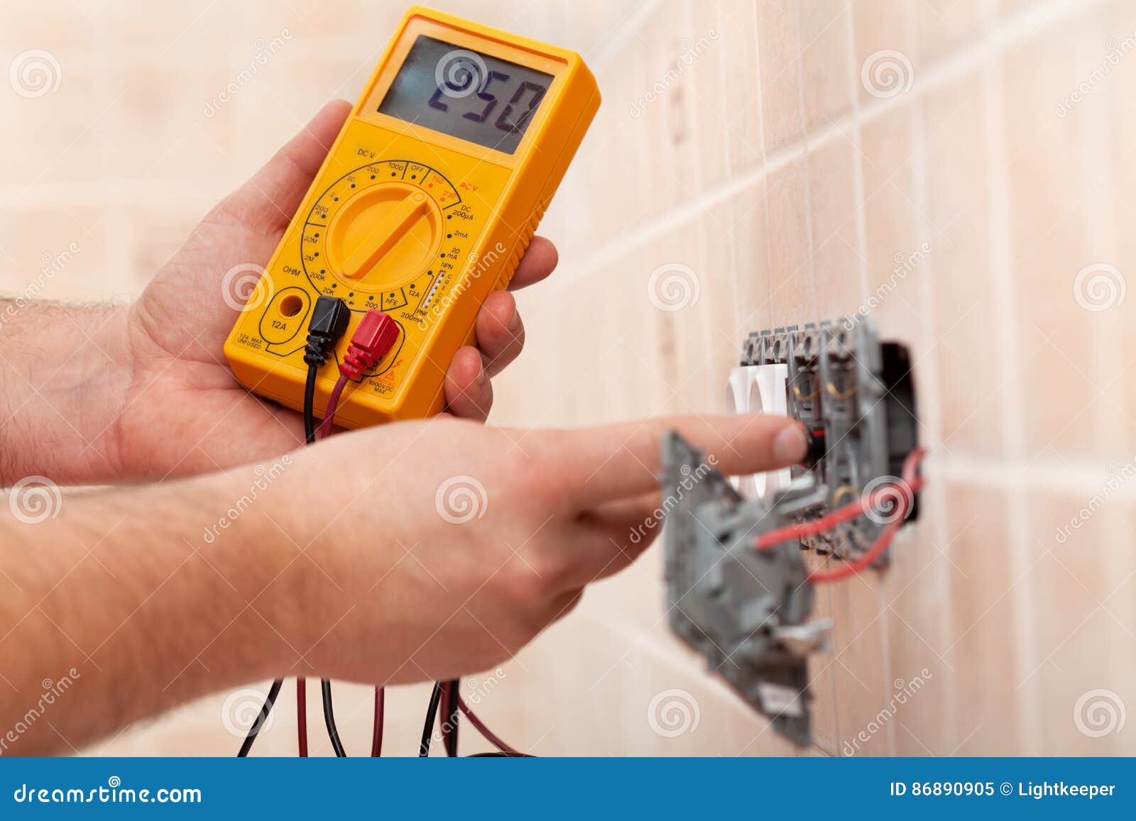 Electrician Hands Checking Voltage in a Partially Mounted Electrical ...