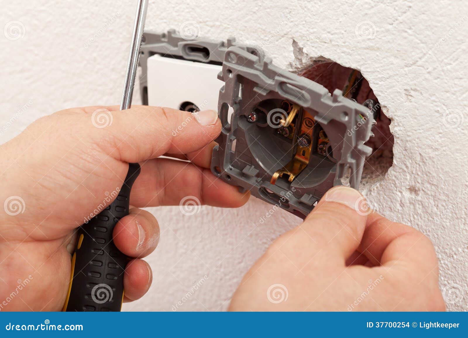 Electrician Hands Installing Wires In Electrical Wall Fixture Royalty ...