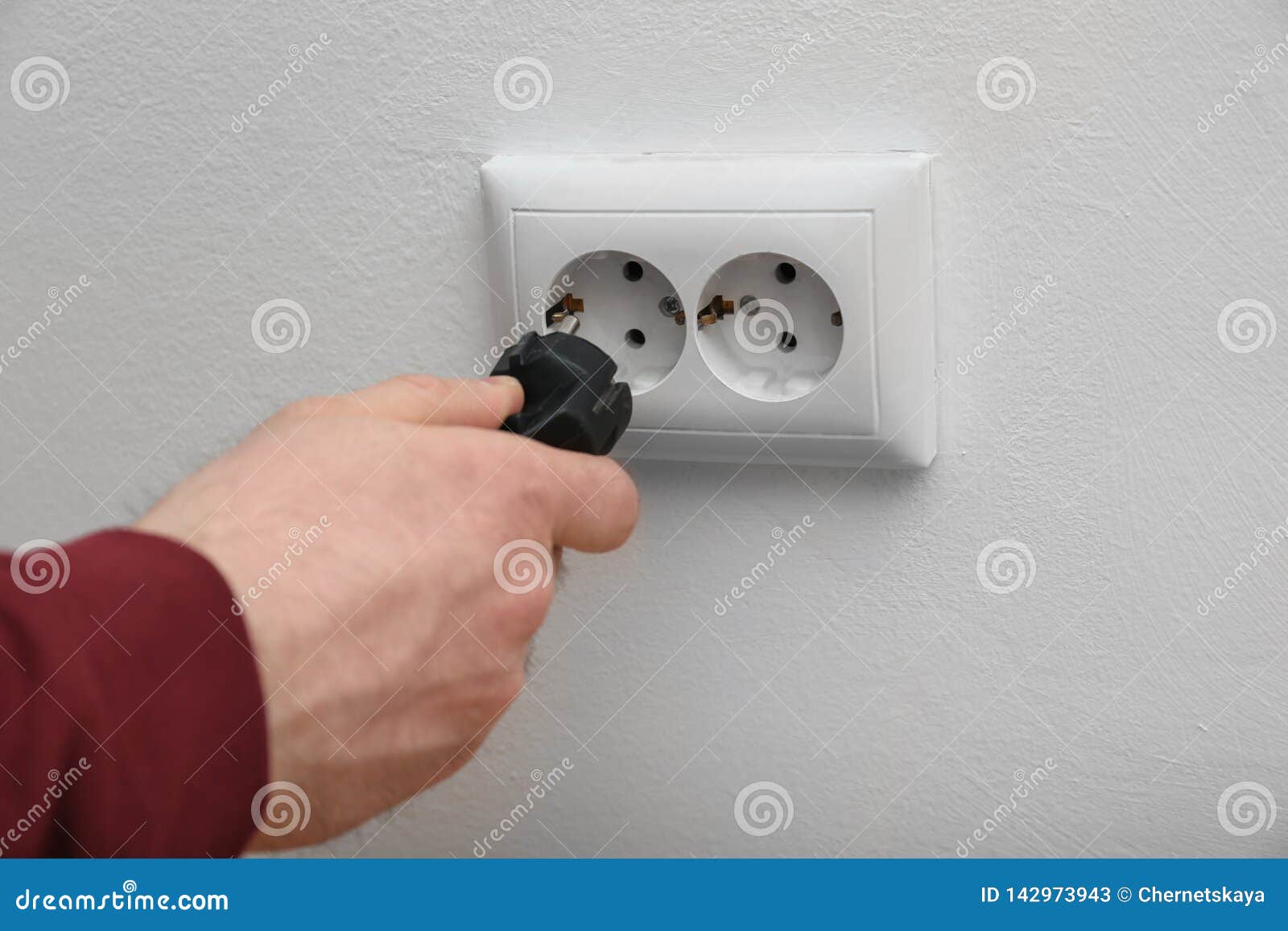 Electrician Inserting Plug into Power Socket on White, Closeup Stock ...