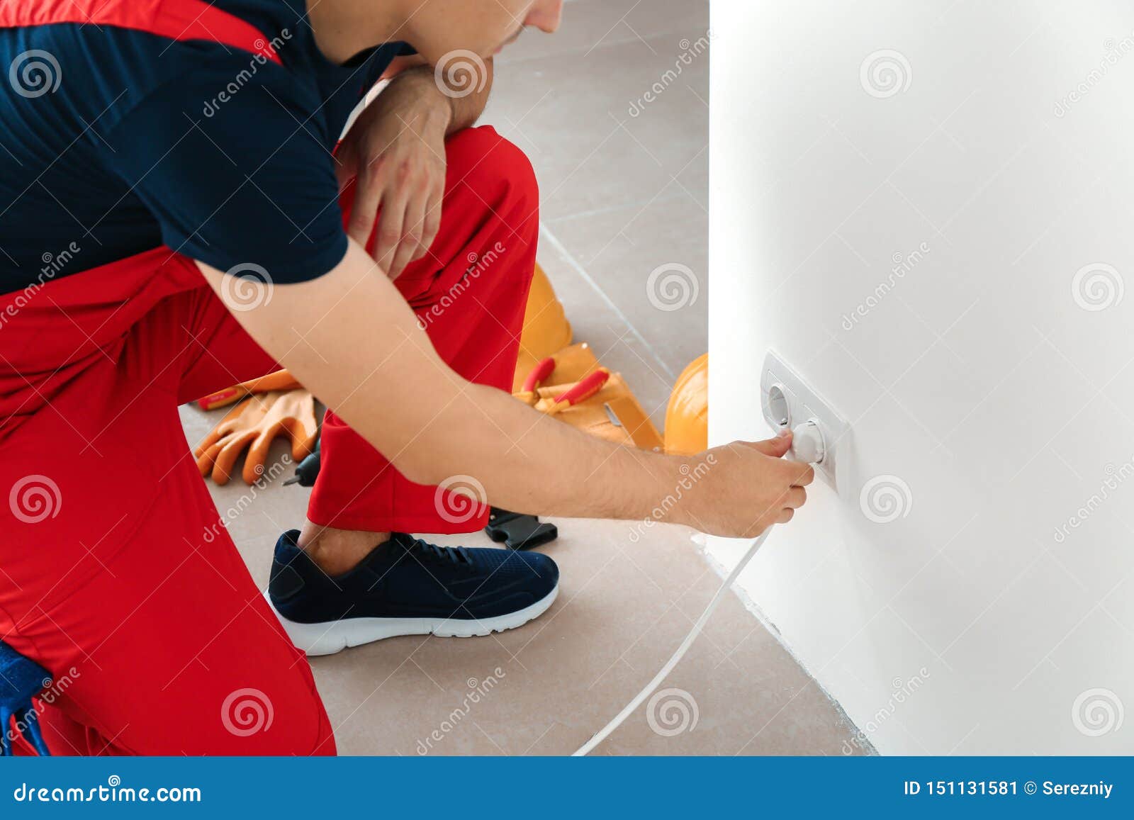 Electrician Inserting Plug into Socket in Order To Check Its ...