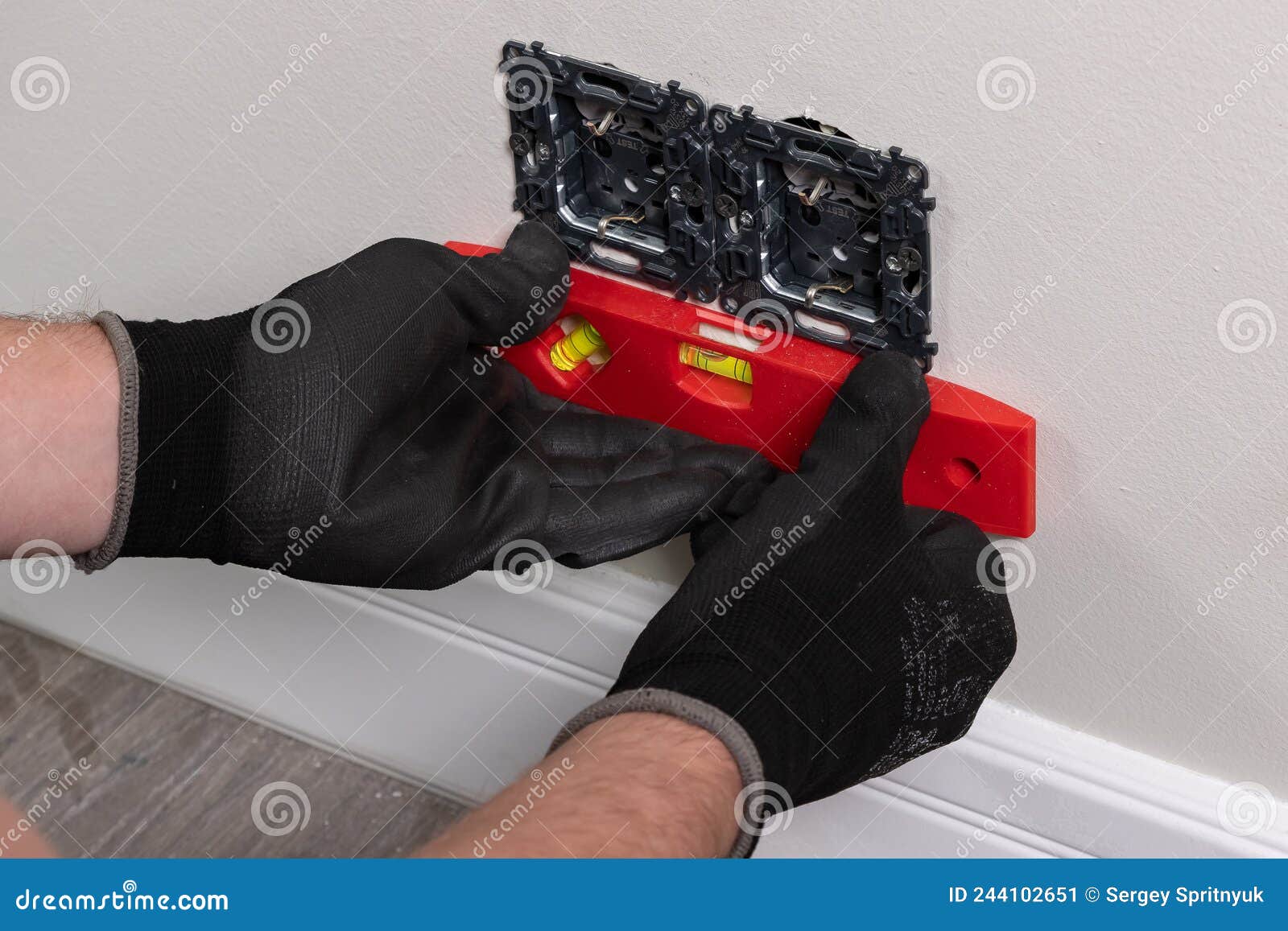 An Electrician Inserts A Black Frame From A Electric Socket With Double ...