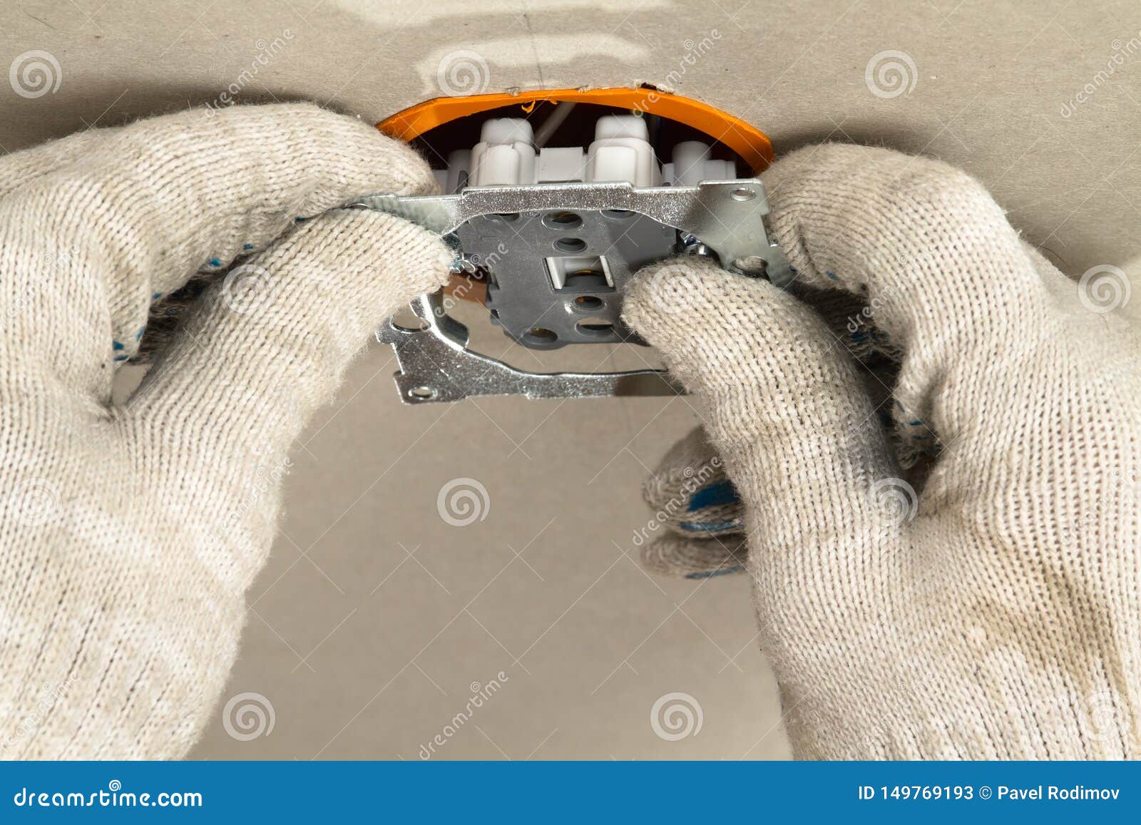An Electrician Inserts A Black Frame From A Electric Socket With Double ...