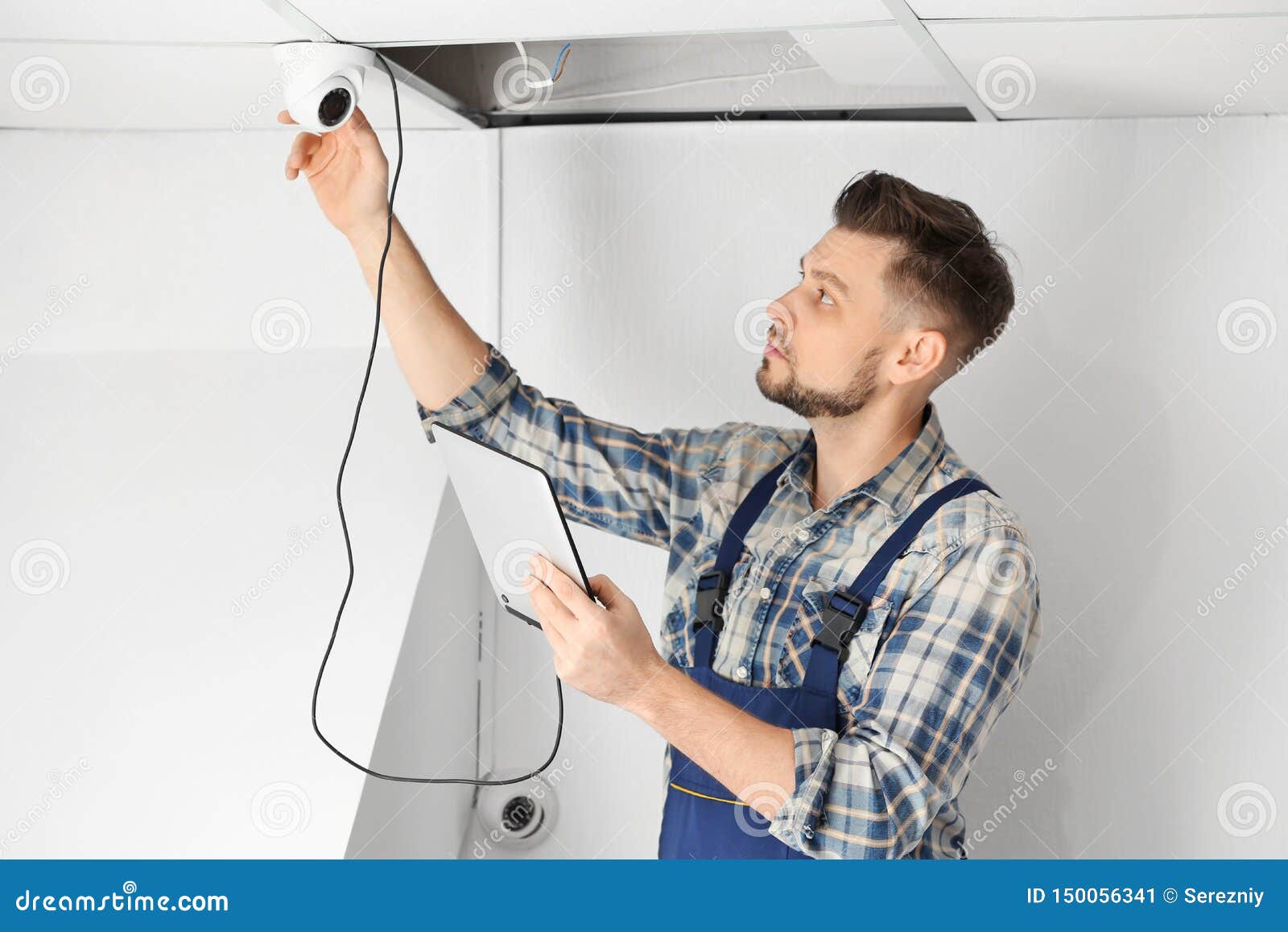 Electrician Inspecting Surveillance Camera Stock Image - Image of ...