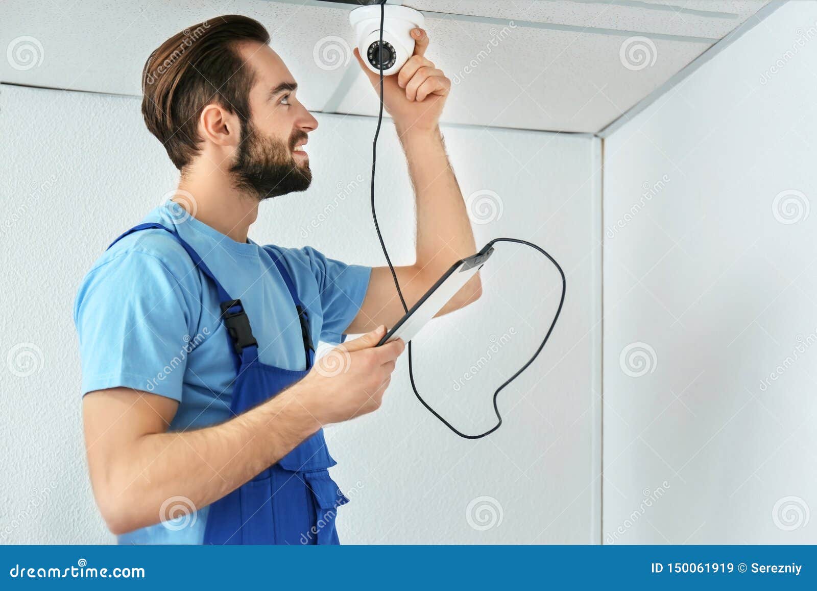 Electrician Inspecting Surveillance Camera Stock Image - Image of ...