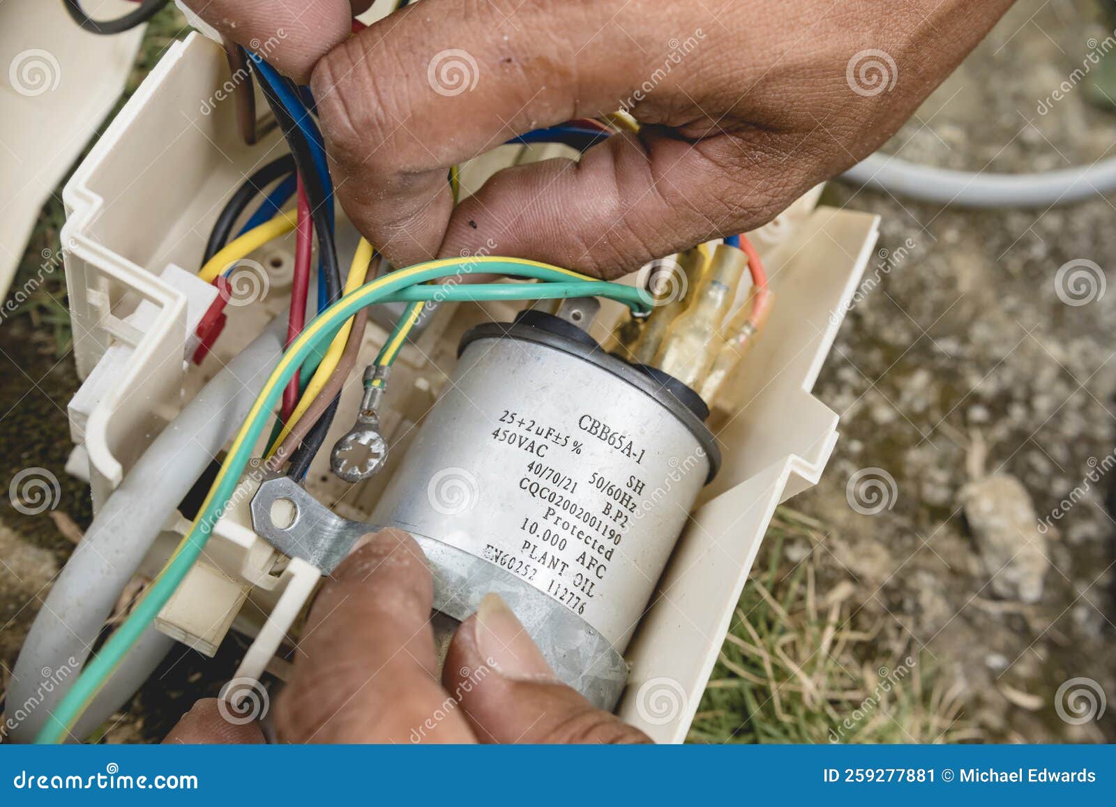 An Electrician Inspects the Wiring Connected To CBB65A-1 Capacitor ...