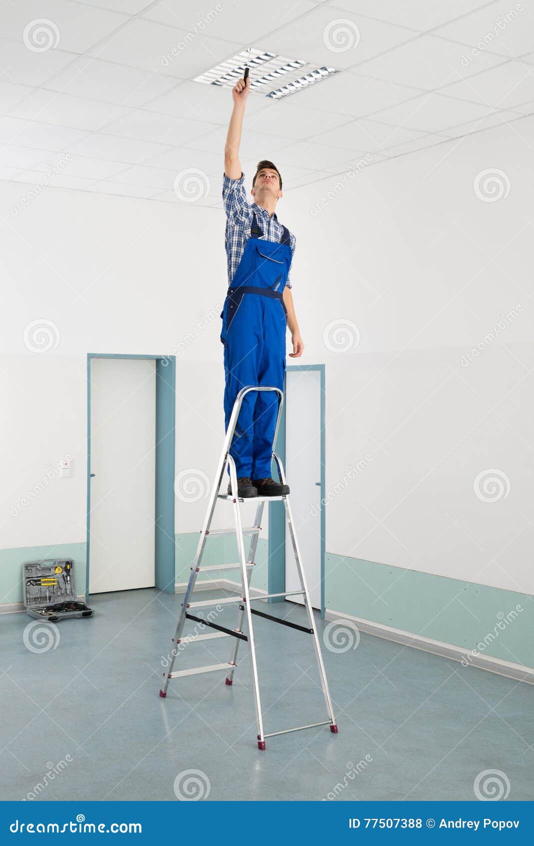 Electrician Installing Ceiling Light Stock Photo - Image of manual ...