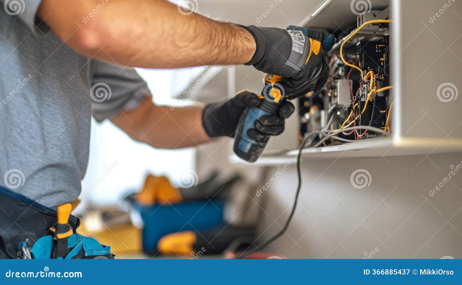Electrician Installing Electrical Outlets In A New Construction Project ...