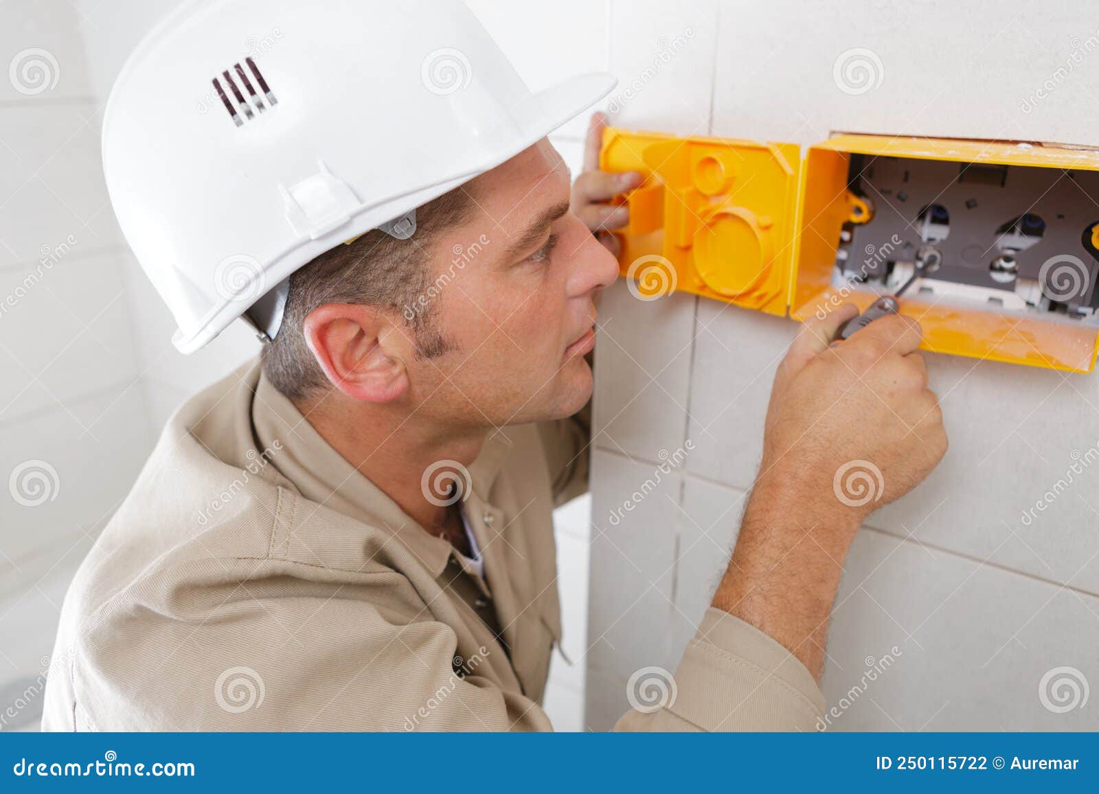 Electrician Installing Electrical Socket Casing in Bathroom Stock Photo ...