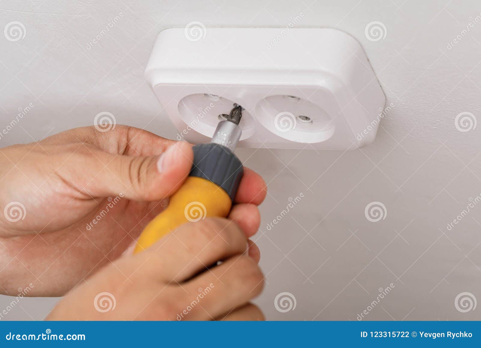 The Electrician Installing the Electrical Socket. Tool Stock Photo ...