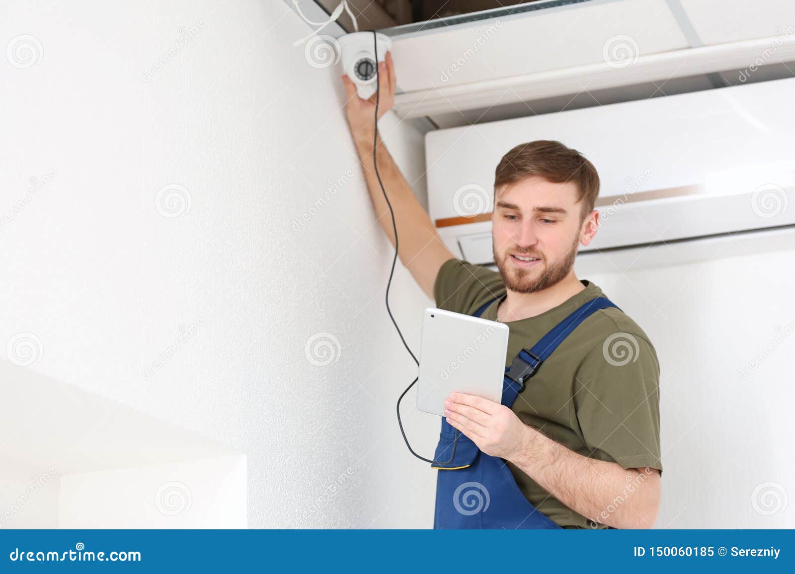 Electrician Installing Security Camera Indoors Stock Image - Image of ...