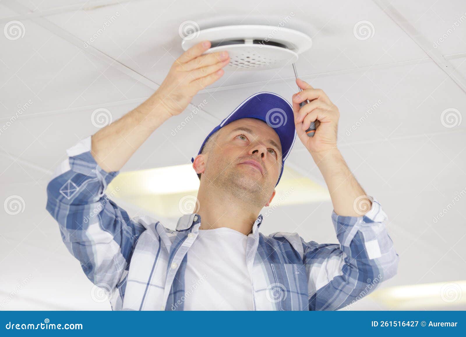 Electrician Installing Smoke Detector on Ceiling Stock Image - Image of ... Electrician Installing Smoke Detector on Ceiling Stock Image - Image of ...