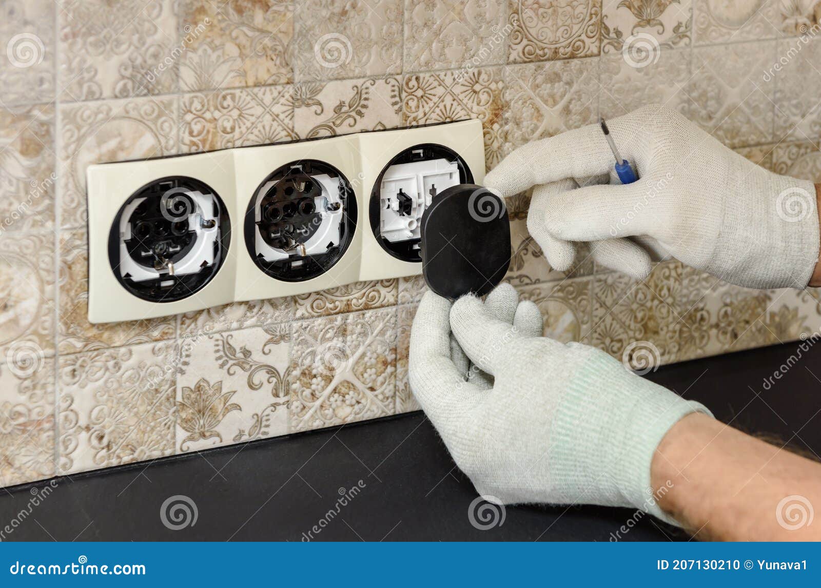 An Electrician is Installing Switches and Sockets Stock Photo - Image ...