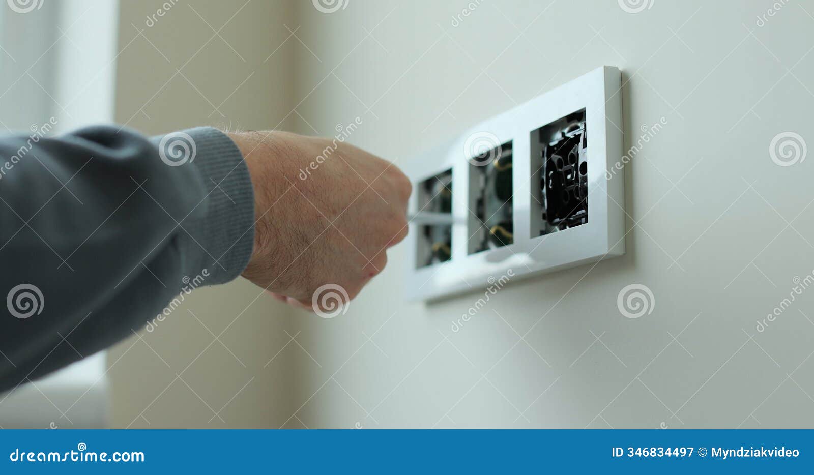 Electrician Installing a Wall Socket. Installing Electrical Wall ...