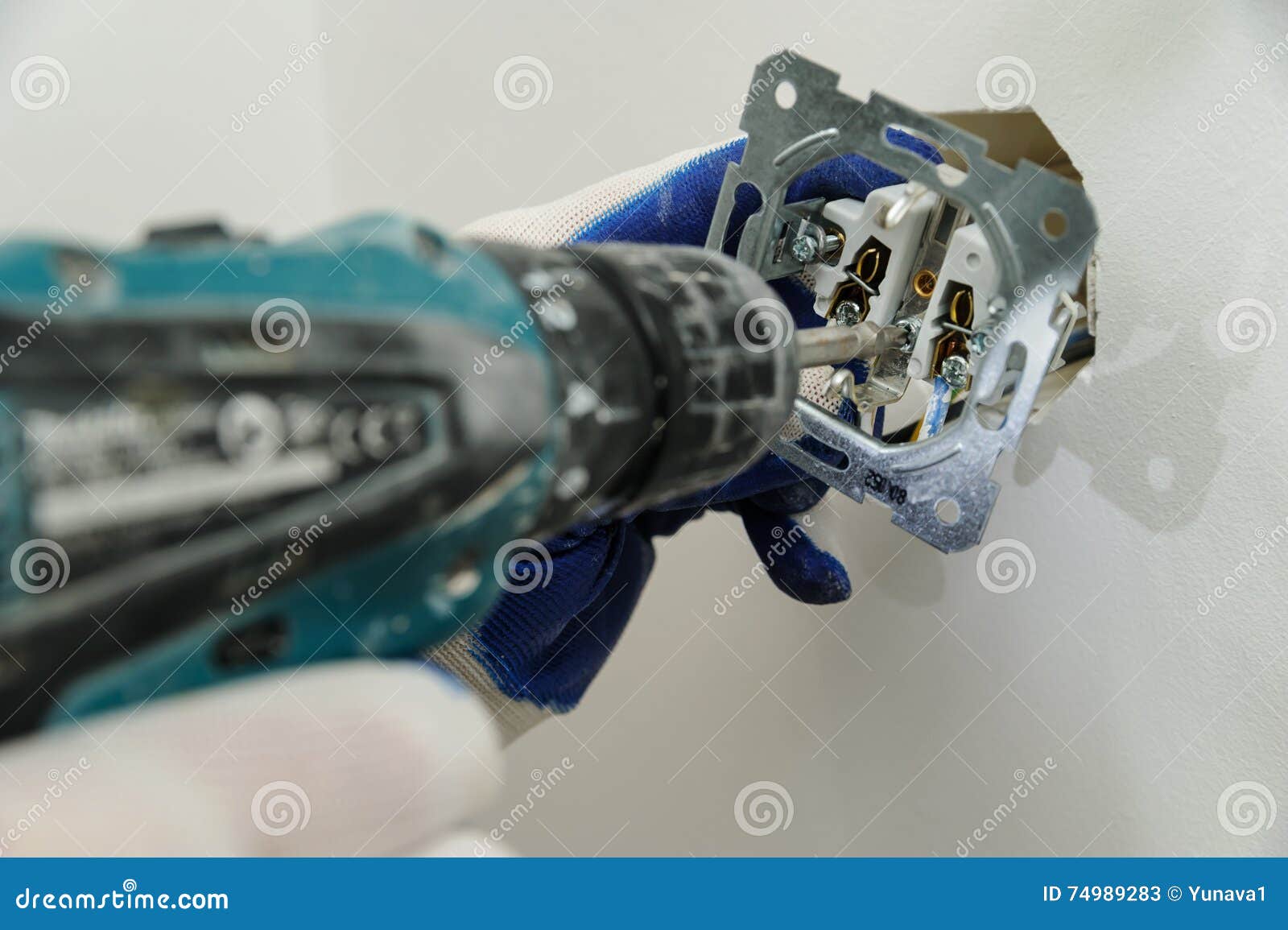 Electrician Installs Electrical Outlet. Stock Image - Image of ...