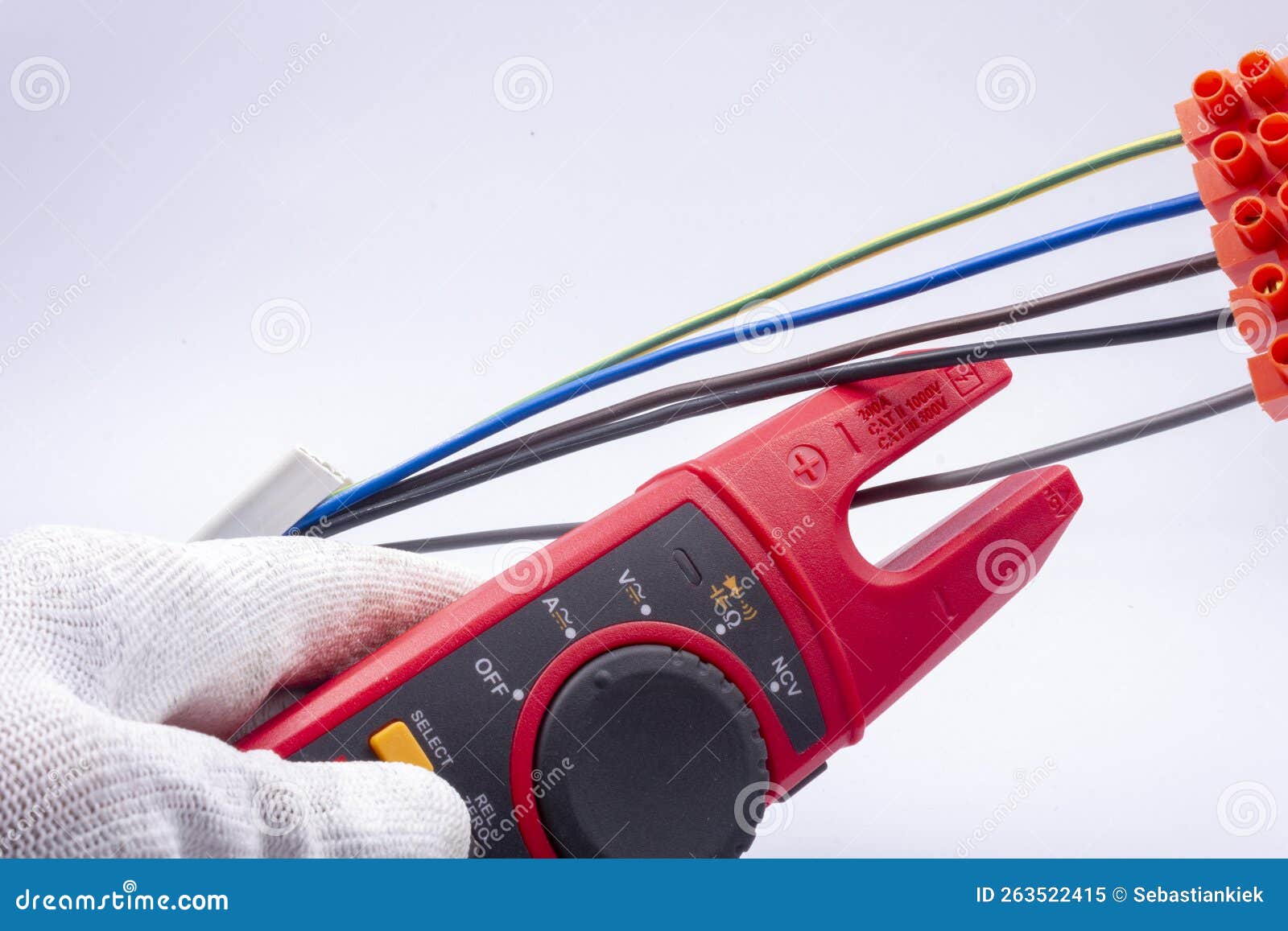 The Electrician Measures the Current in the Phase Wire with a Meter ...