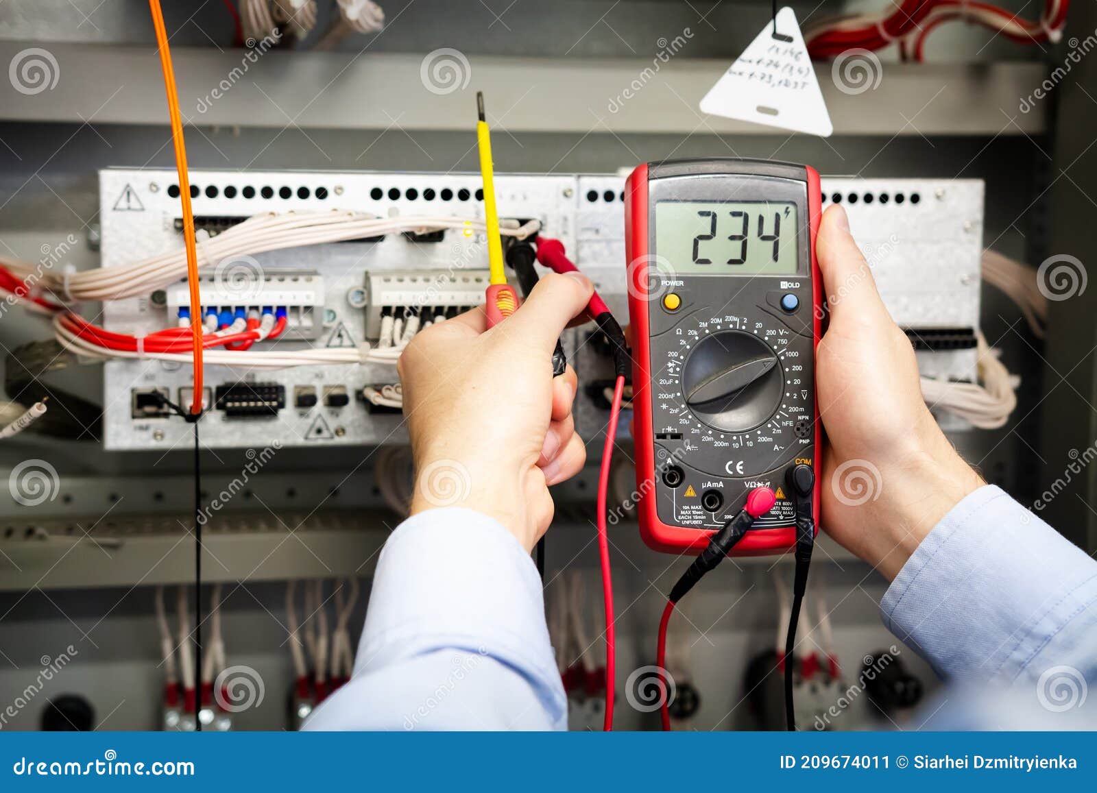 Multimeter In Hands Of Electrician Engineer In Electrical Cabinet ...