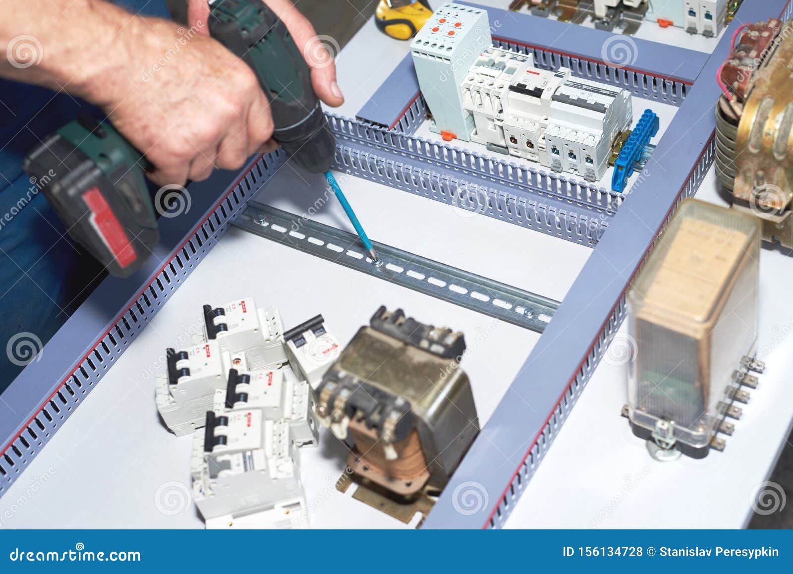 The Electrician Performs the Installation and Configuration of High ...