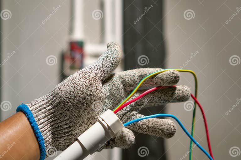 Electrician Pulling Wire into PVC Conduit Stock Image - Image of ...