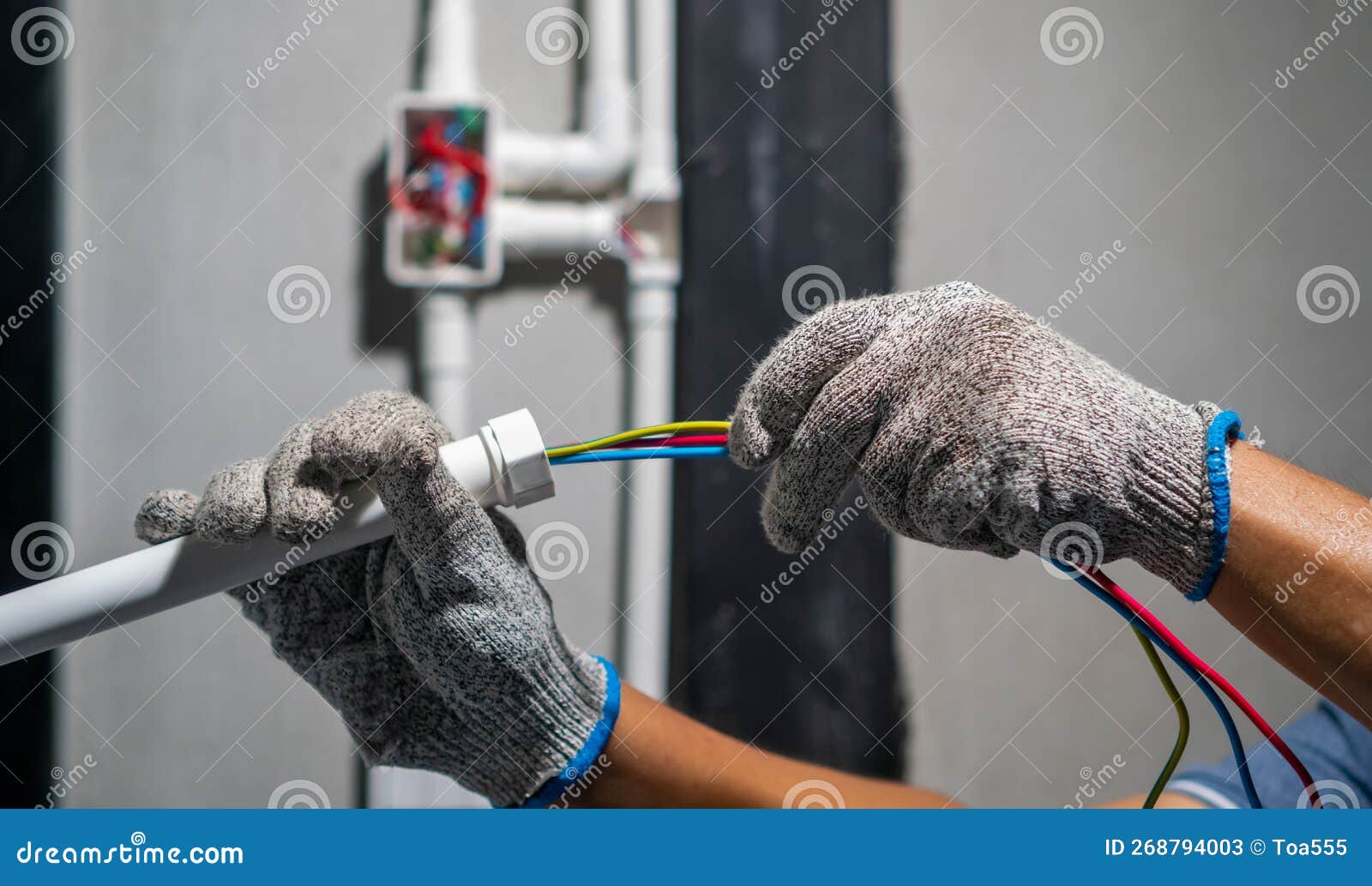 Electrician Pulling Wire into PVC Conduit Stock Image - Image of ...