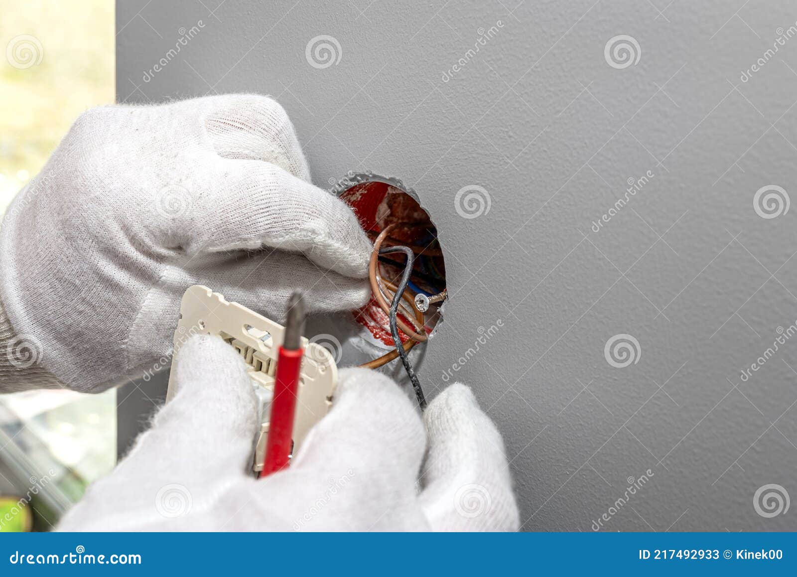 The Electrician Puts the Roller Shutter Switch Up and Down in the ...