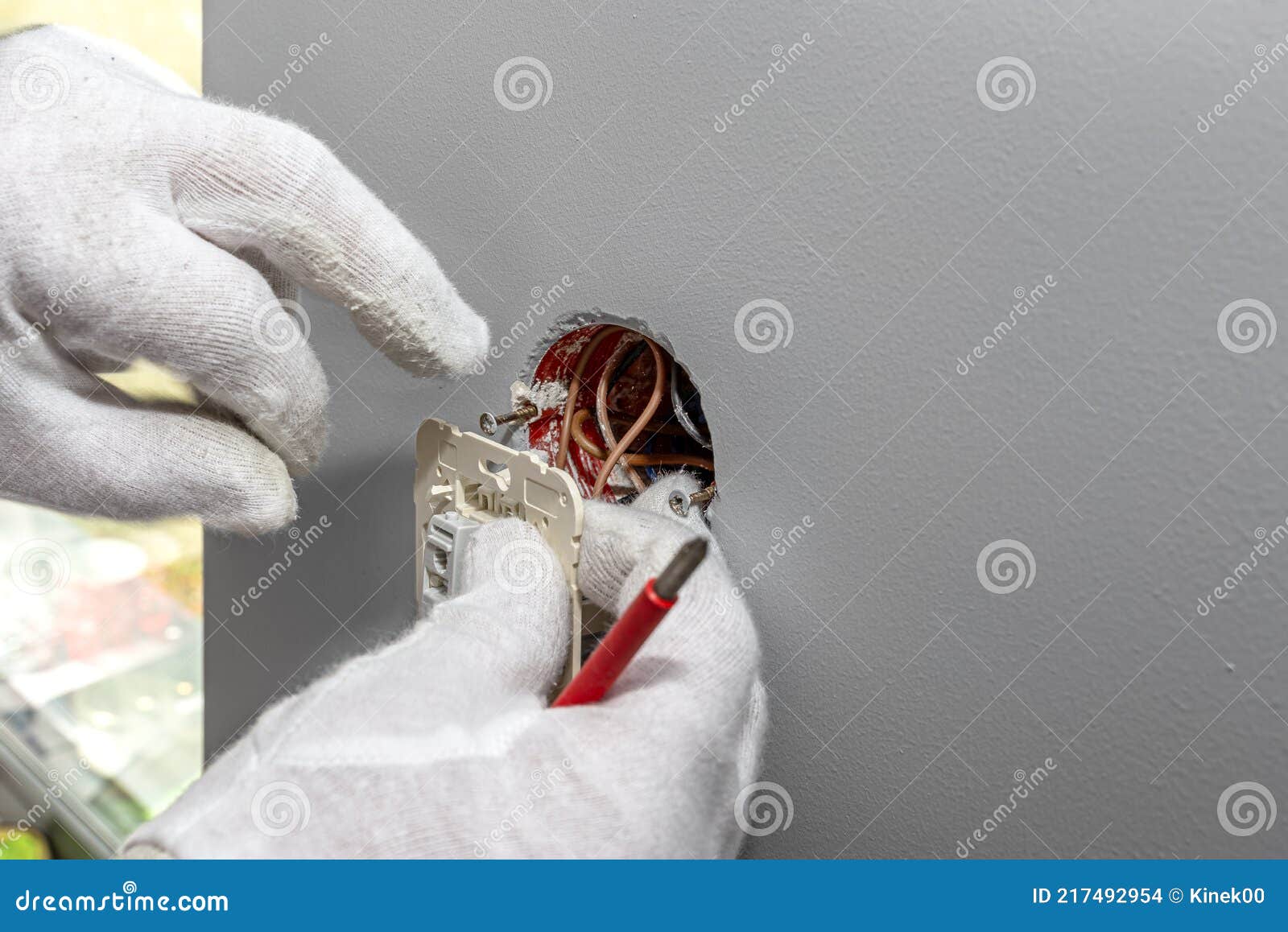 The Electrician Puts the Roller Shutter Switch Up and Down in the ...