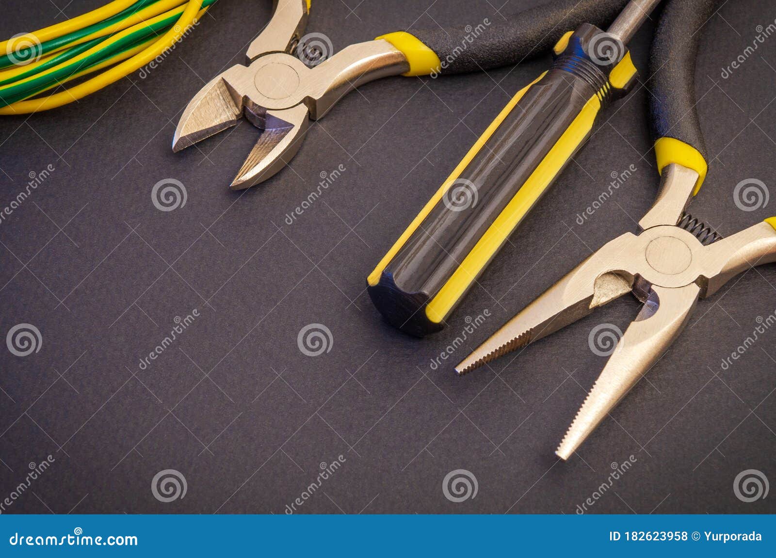 Electrician`s Tools and Wire on Black Background for Repairing ...