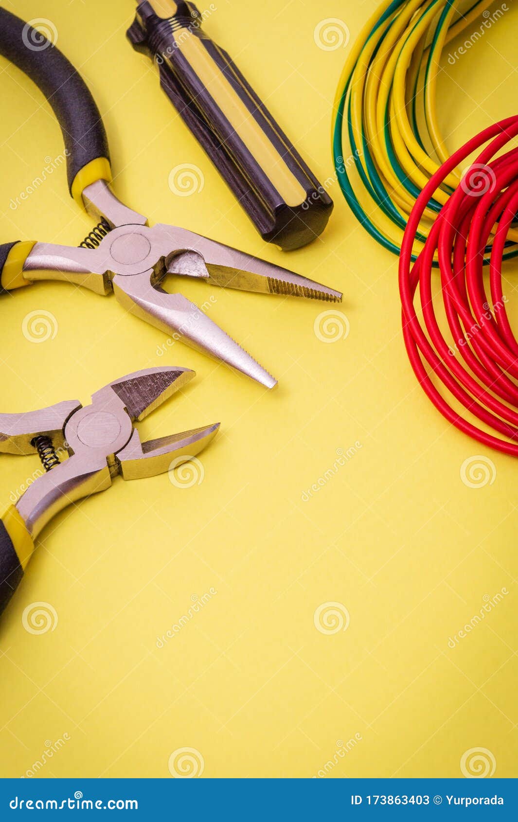 Electrician`s Tools and Wire on Yellow Background for Repairing ...